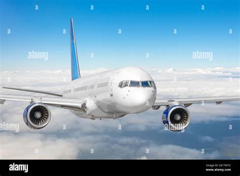 Passenger Jet Plane In The Blue Sky Aircraft Flying High Through The