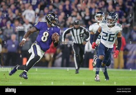 Ravens Quarterback Lamar Jackson Tries To Evade Tacklers During Last