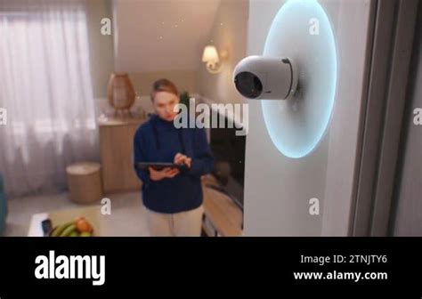 Adult Woman Sets Up Security Camera With Ai Recognition At Home Using