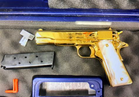 Woman Charged Over Alleged Gold Plated Gun Import