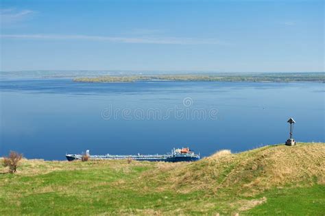 An Empty Cargo Barge At The Shore Against The Blue Sea And Sky Stock