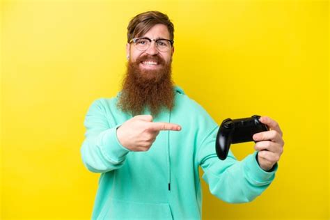 Premium Photo Redhead Man With Beard Playing With A Video Game
