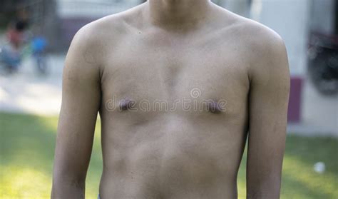Close Up Of A Young Mans Bare Chest Outdoors In Natural Light Stock