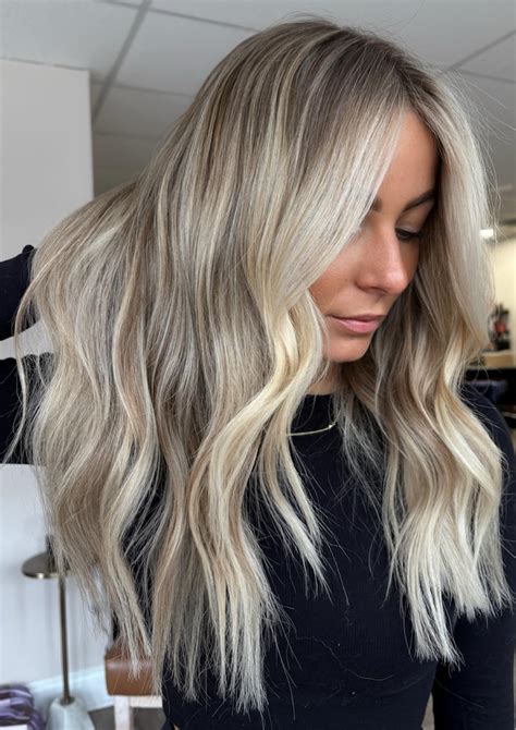 Icy Beige Blonde Balayage With Face Framing Highlights Modern Bright