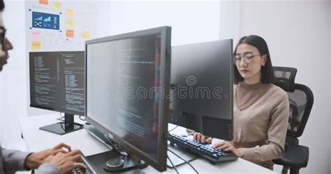 Young Adult Asian Male Female Software Developer Coding Program On