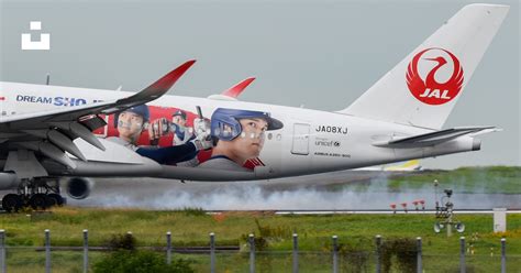 Airplane With Baseball Player Livery Lands On Runway Photo Free
