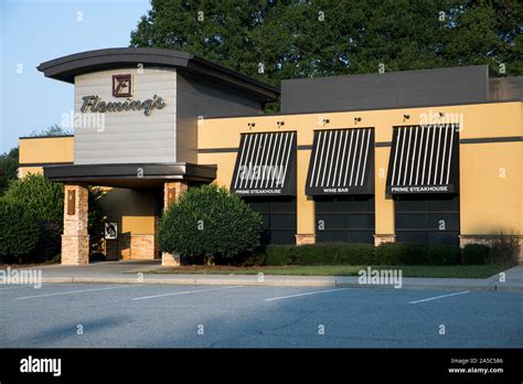 A Logo Sign Outside Of A Flemings Prime Steakhouse Restaurant Location