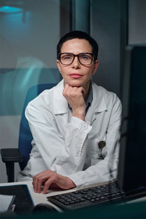 Portrait Of Female Scientist Sitting At Desk Looking Thoughtful Stock Image Image Of