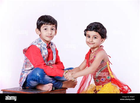 Cute Indian Brother And Sister Celebrating Raksha Bandhan Festival