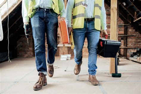 Premium Photo Construction Team And Legs Of Engineers Walking On The