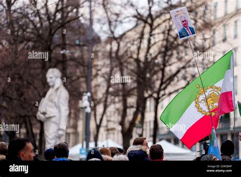 Munich Germany 20250215 A Woman Holds Old Iranian Flags And A Picture