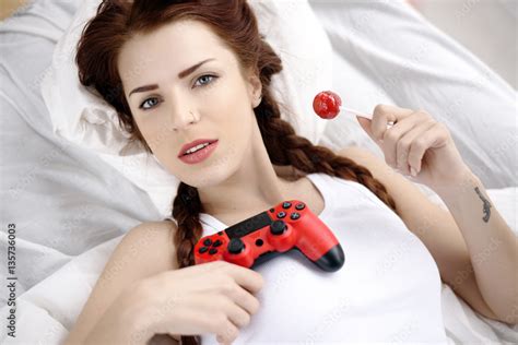 The Concept Of Lifestyle And Technology Young Girl Playing On A