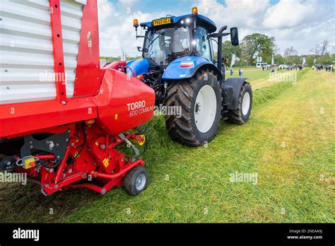 Picking Up Grass To Make Silage With A Pottinger Forage Wagon Pulled By
