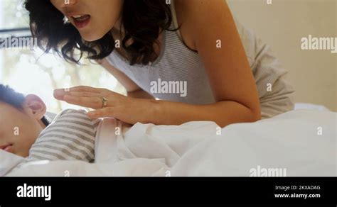 Mother Waking Up Her Son In Bedroom K Stock Video Footage Alamy