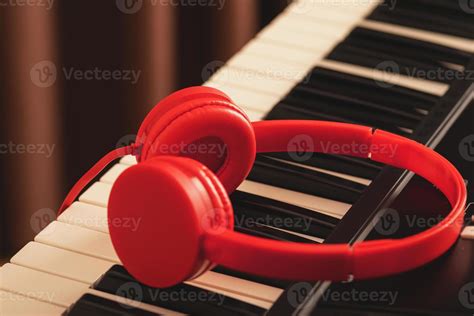 Closeup Of Red Headphones Over Synthesizer Keyboard 16251170 Stock