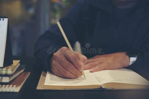 Male Hand Of Planner Writing Diary Working Space At Home Man Plan And Noted Schedule Holiday