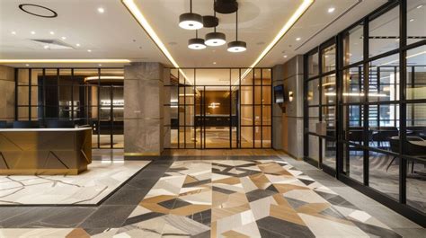 Contemporary Lobby Design With Eyecatching Lighting And Glass Partition
