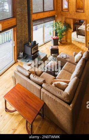 Top View Of Tan Leather Sectional Sofa With Wood Burning Stove On