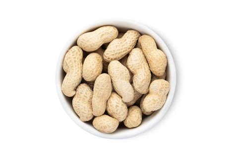 Bowl With Healthy Peanuts Nuts With White Shell Isolated On White Background Top View Stock