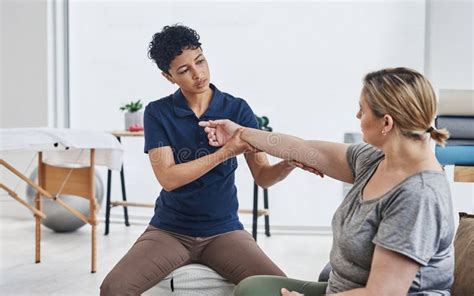 Physiotherapy Woman And Medical Consultant With Examination And