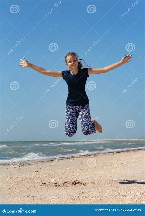 Happy Girl Jumping On The Beach Stock Image Image Of Sand Style