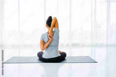 Female Doing Stretching Exercises Yoga Practice Hands Behind Back