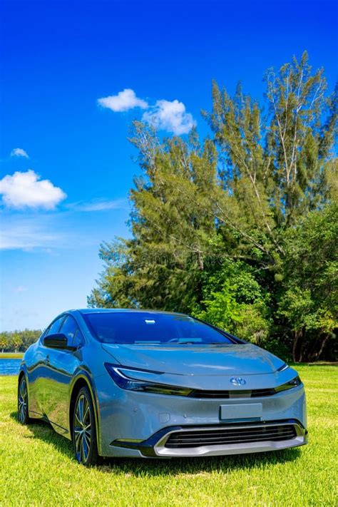 2025 Toyota Prius Hybrid Gas Electric Vehicle Guardian Gray Parked In