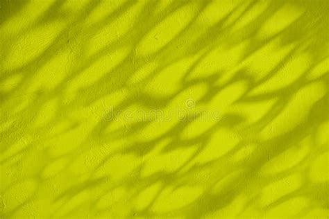 Shadow And Light On Solid Yellow Wall Texture Background Stock Image