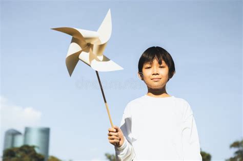 Little Asian Boy Holding Windmill Or Wind Turbine Mockup Model Gyre