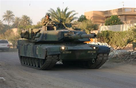 A Us Army Usa M1a1 Abrams Mbt Main Battle Tank And Personnel From