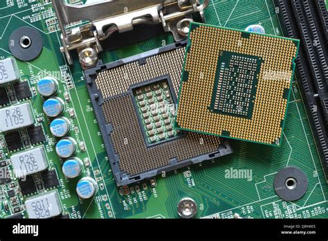 Detail Of A Cpu Processor Over His Socket On A Motherboard Printed