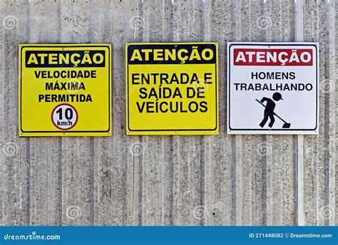 Metal Signs Indicating Construction Site With Words In Portuguese