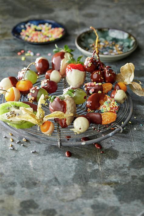 Colourful Chocolate Covered Fruit On A Cooling Rack Photograph By Meike