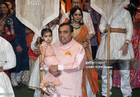 Indian Businessman Mukesh Ambani Poses For A Photo With Granddaughter
