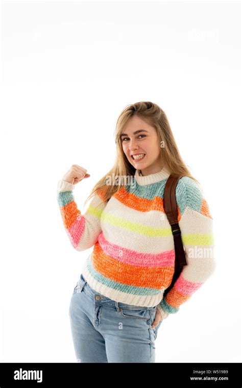 Beautiful Millennial Teenager Girl With Backpack And Folder Smiling And
