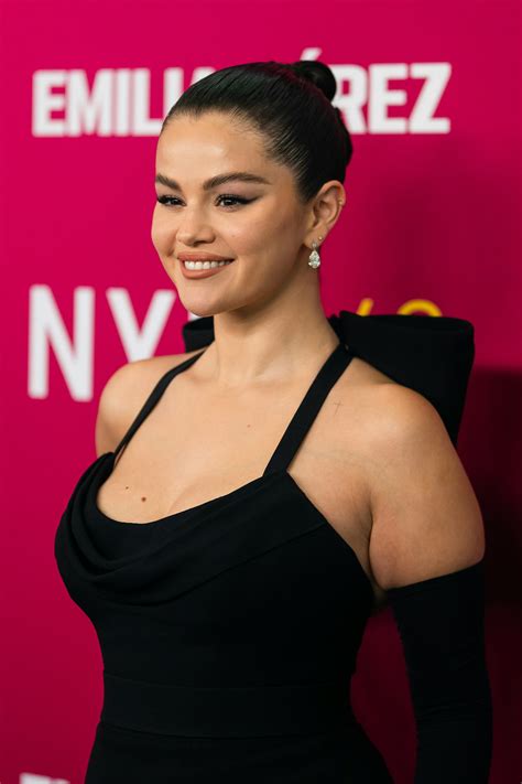 Selena Gomez Paired A Plunging Top & $120 Jeans With A $1,900 Bag