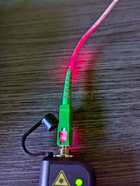 Detail Of A Device Testing An Optical Fiber Through Which Data Passes