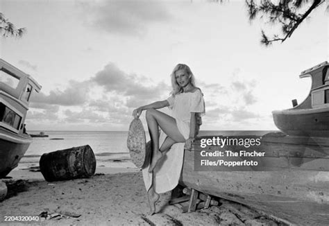 British Actress And Model Jilly Johnson Posing On A Beach Amidst