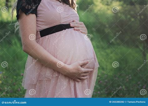 Pregnant Belly A Woman Shows Her Pregnant Belly Cute Pink Dress