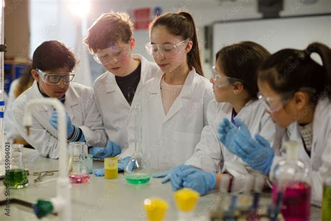 Surprised Students Conducting Exploding Foam Scientific Experiment In