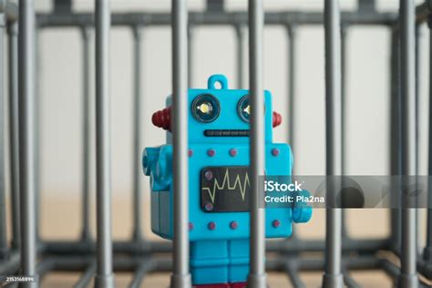 Close Up Ai Artificial Intelligence Bot In Jail With White Wall