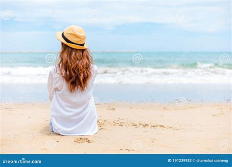 Girl Sitting Alone On Beach