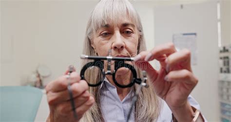 Mature Woman Optometrist And Frame For Eye Lens Or Equipment For Exam