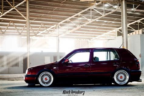 Maroon Volkswagen Golf In Empty Garage