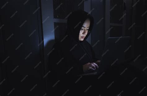 Premium Photo Hacker Server Room And Person On Laptop For Coding Software Data Center Crime