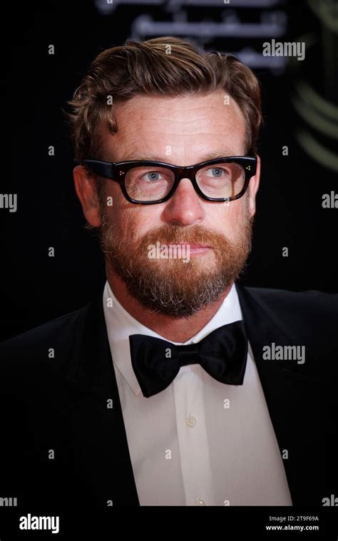 Simon R Baker Poses For Photographers Before The Opening Ceremony Of