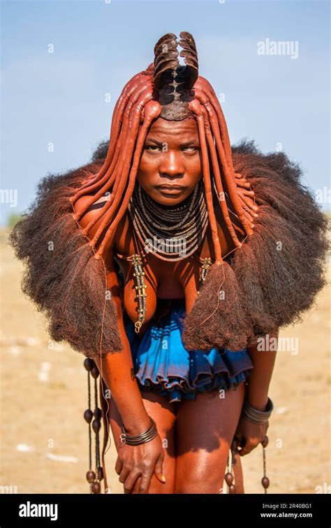 Portrait Of A Young Woman Of The Himba Tribe With A Traditional