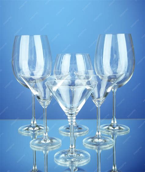 Premium Photo Cocktail And Wine Glasses On Blue Background