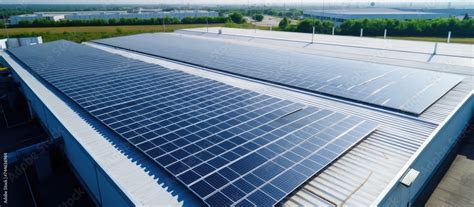 Top View Photo Of Solar Panels Pv Modules On Warehouse Roof Capturing