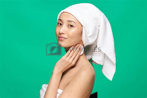 Woman Of Asian Appearance Naked Shoulders Towel On Head Green